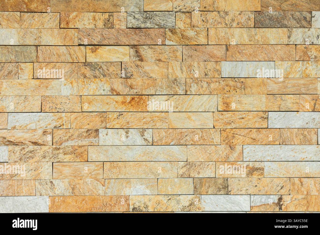 A beautifully crafted Textured Stone Wall featuring harmonious Earthy ...