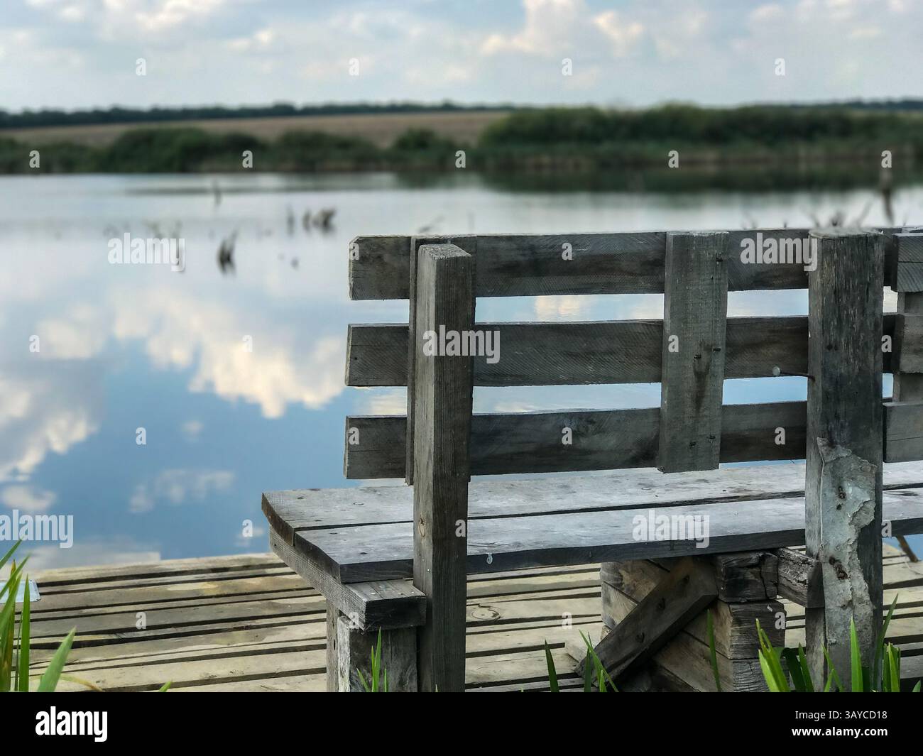 View bench lake reflecting greenery hi-res stock photography and images ...
