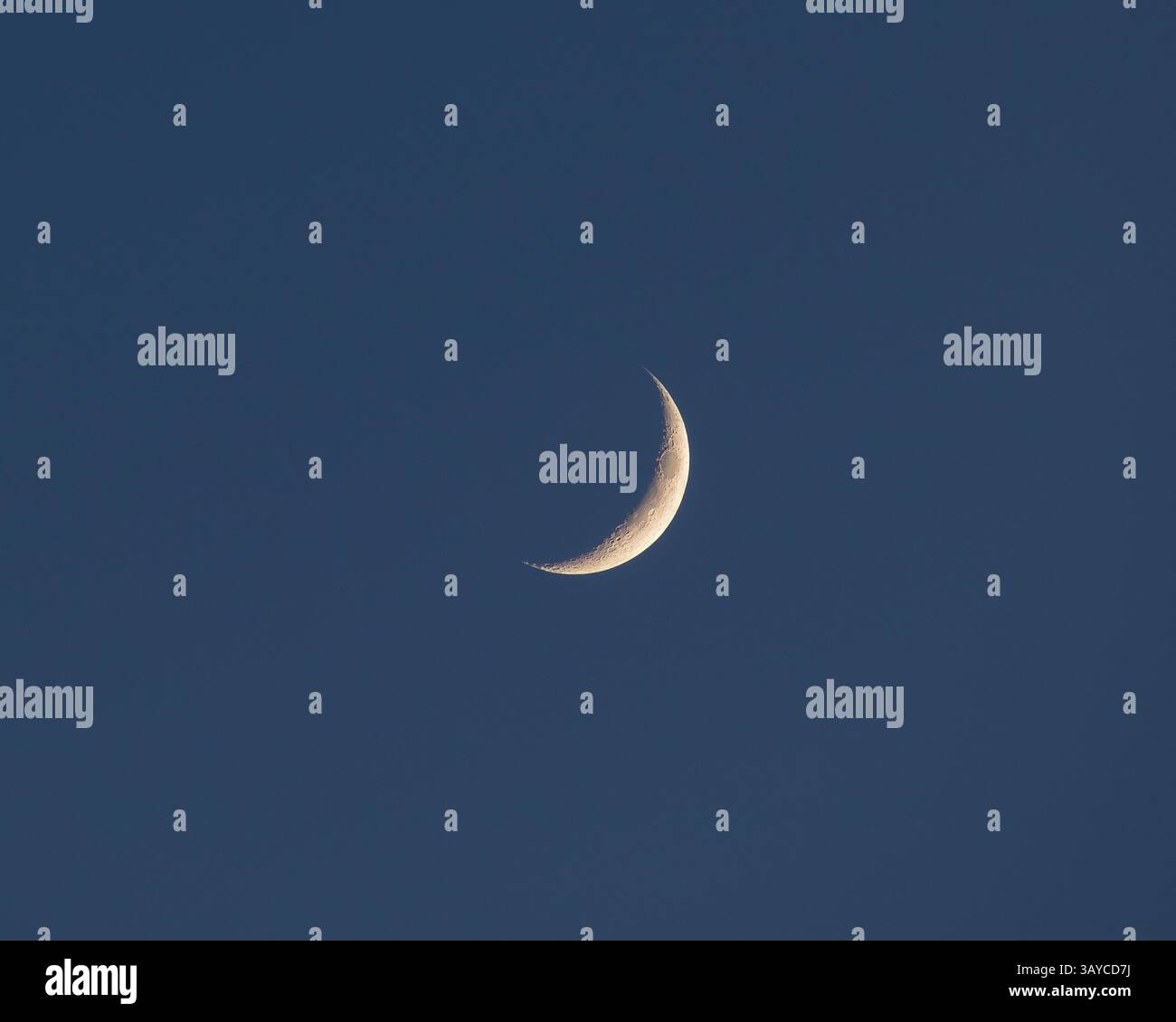 Early summer moon during sun storms lighting the sky and colouring the ...