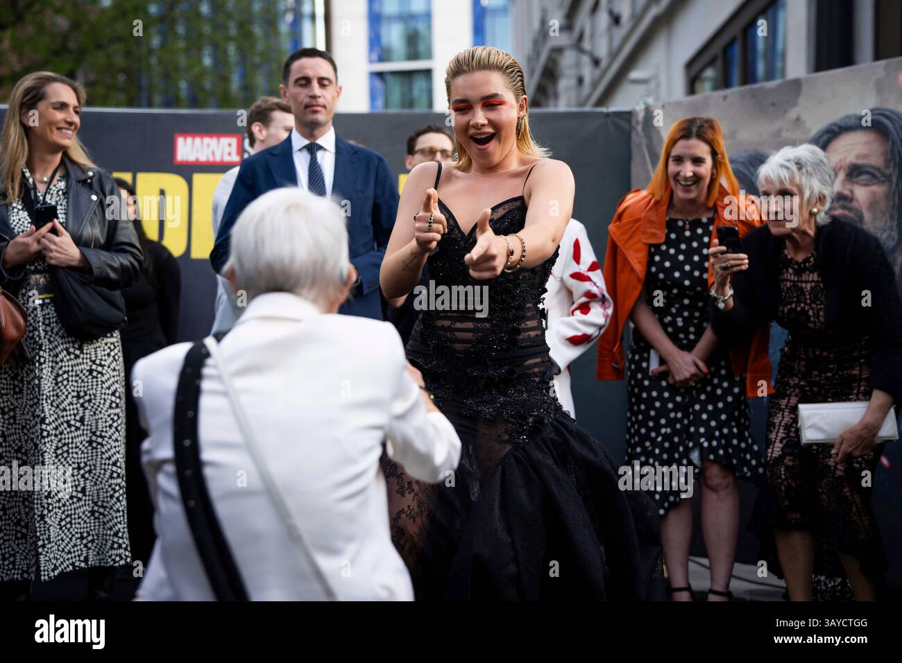 Granzo Pat, left, and Florence Pugh pose for photographers upon arrival ...