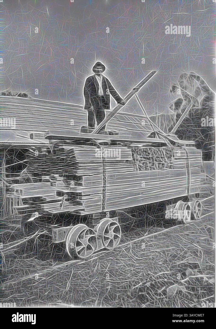 Two individuals work on a stack of lumber, with one standing atop the ...