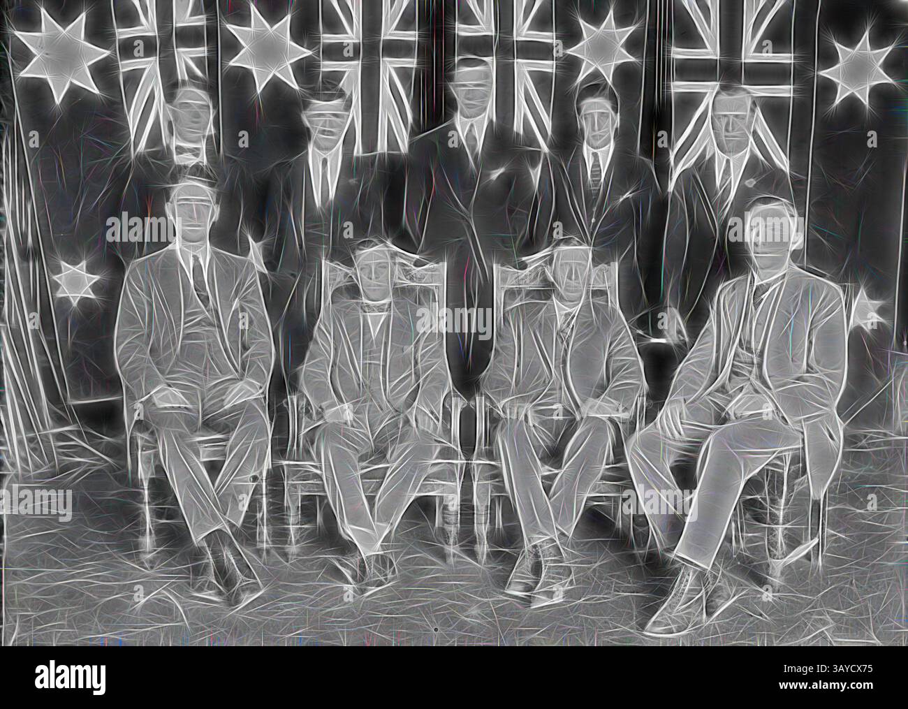 A group of ten men, dressed in formal attire, poses together, with some ...