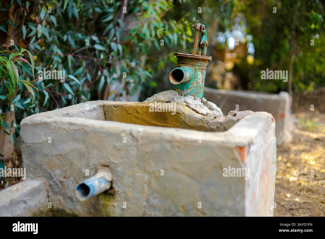 Stone Water Tap in Village Farm with Vintage Look Stock Photo - Alamy