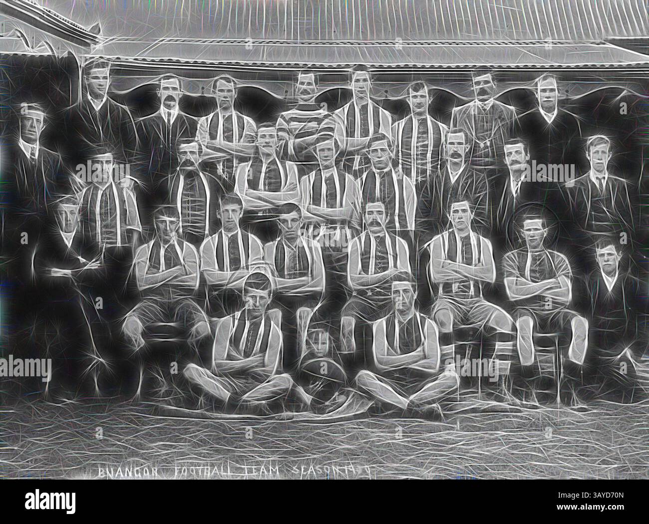 A historic football team poses confidently, wearing striped uniforms ...