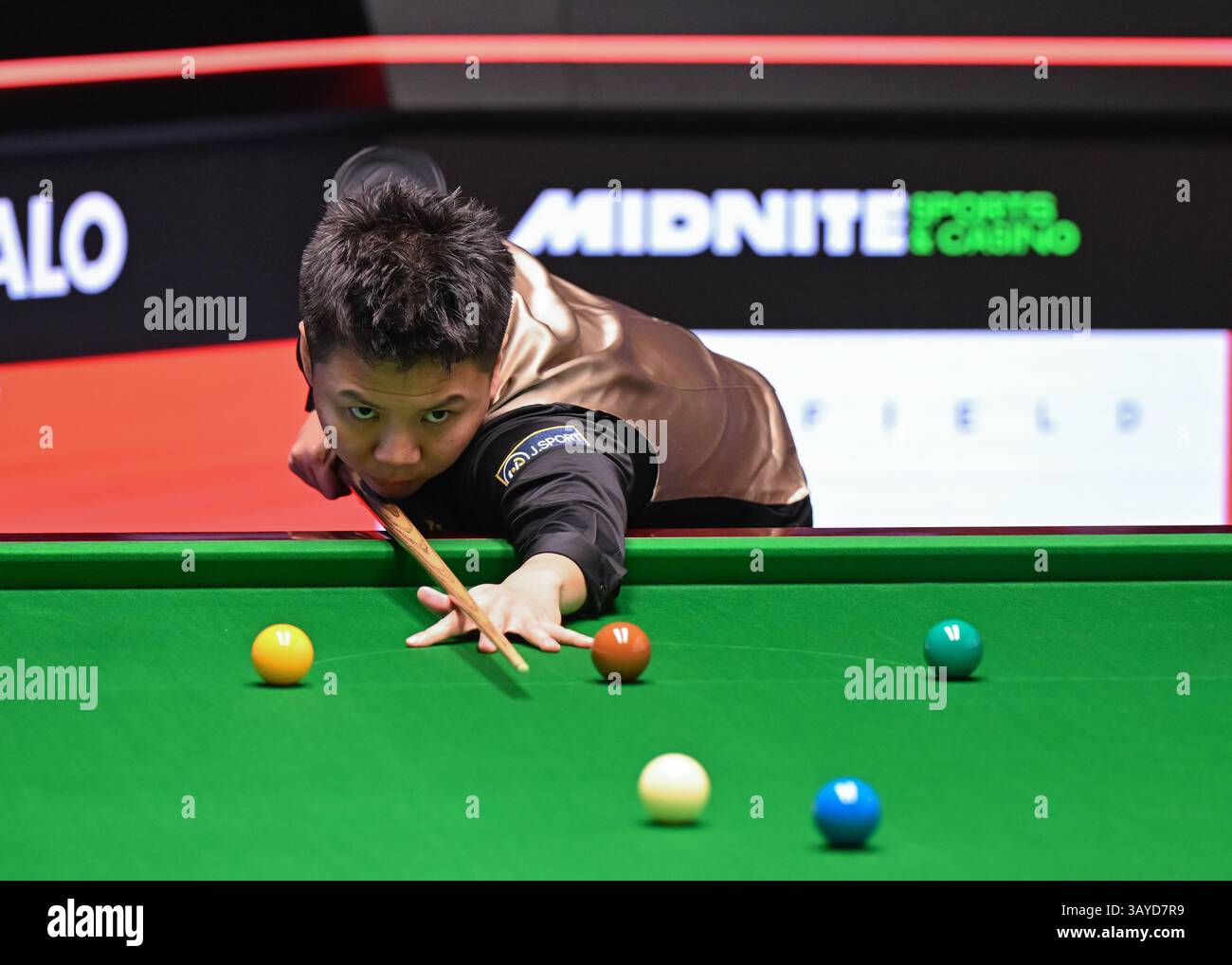 Sheffield, UK. 22nd Apr, 2025. Zhou Yuelong takes a shot during his ...