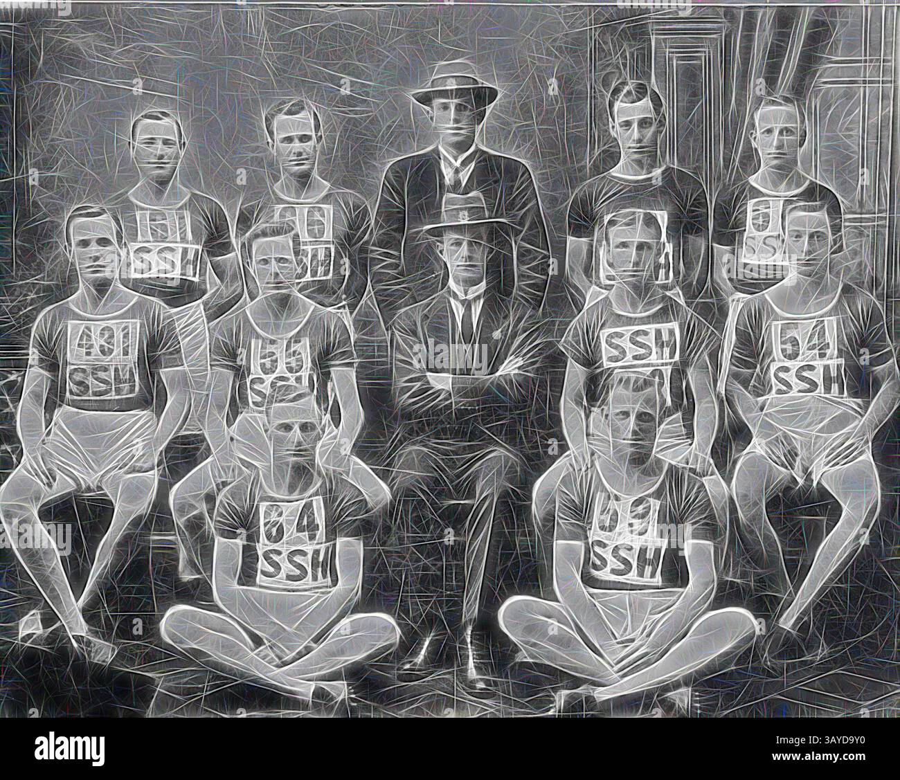 A group of men in sports attire pose for a team photo, with some ...