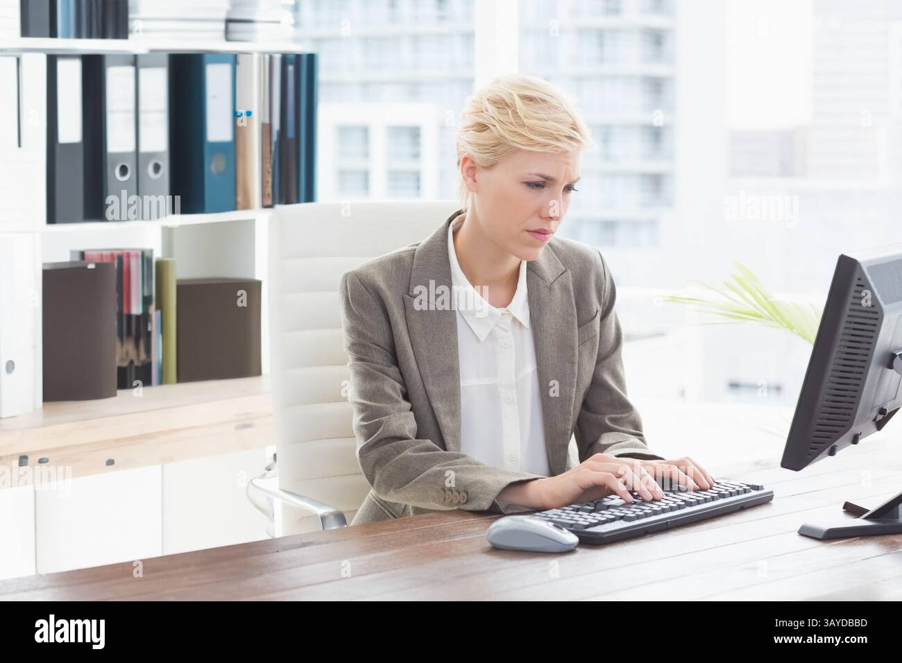 Bi racial woman typing hi-res stock photography and images - Alamy