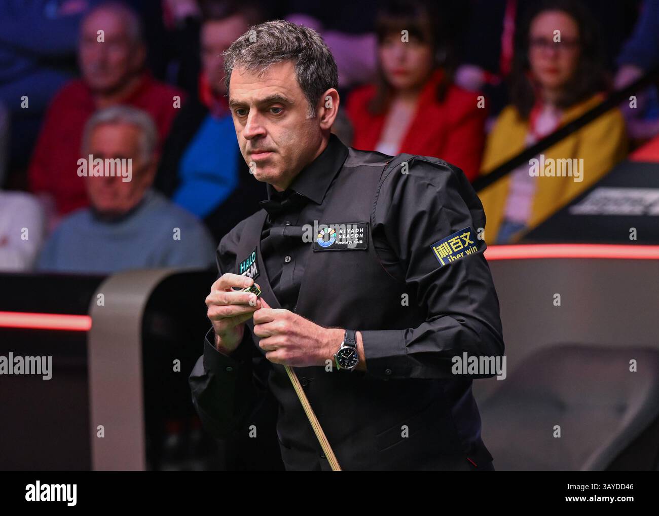 Sheffield, UK. 22nd Apr, 2025. Ronnie O'Sullivan chalks his cue during ...