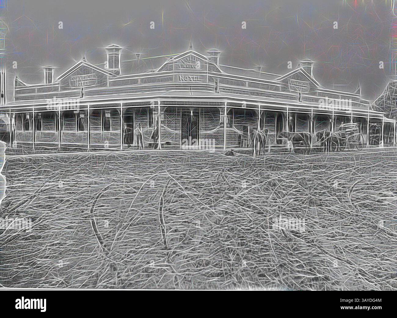 A historic building with a long porch features large signs identifying ...