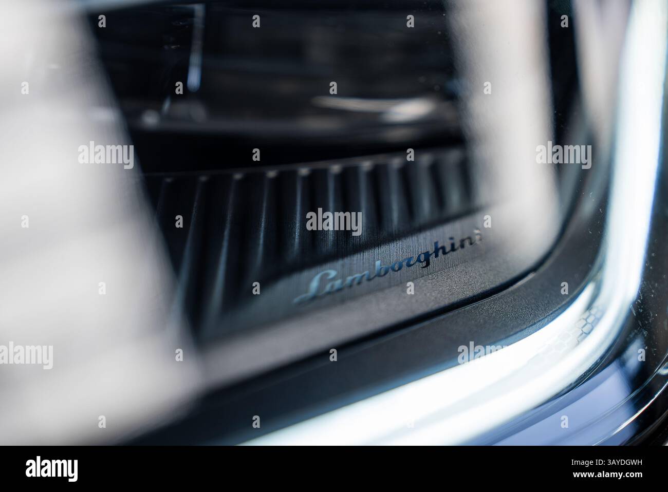 Detailed view of a Lamborghini headlight featuring sharp lines, bright ...