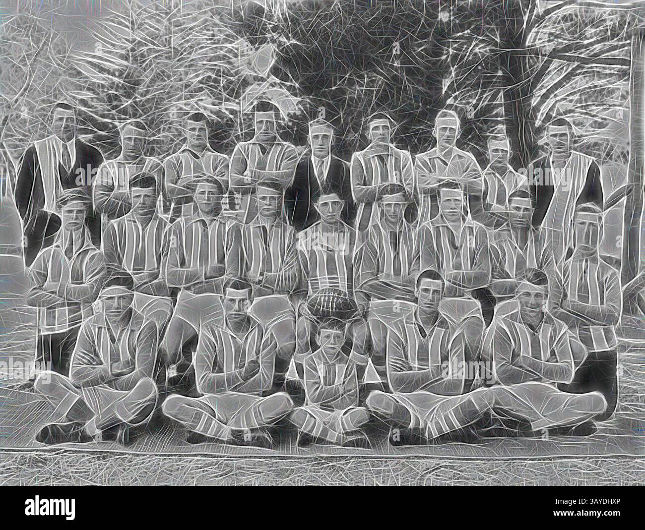 A group of young men in sports attire, posing together in a forested ...