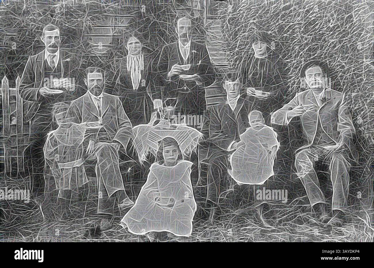 A group of individuals poses together, arranged in two rows. They hold ...