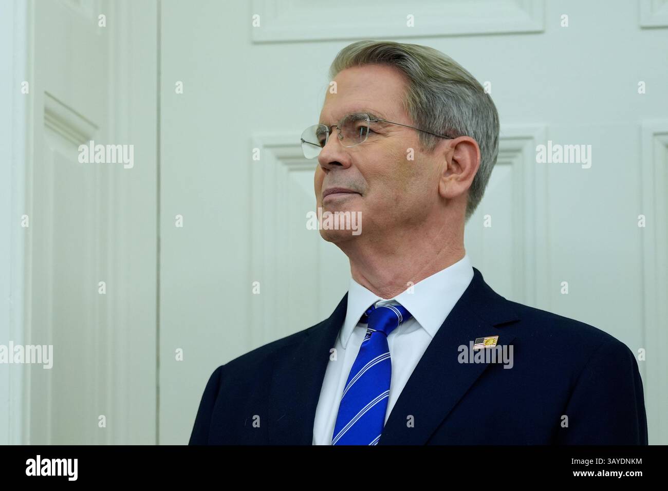 Treasury Secretary Scott Bessent listens as President Donald Trump ...