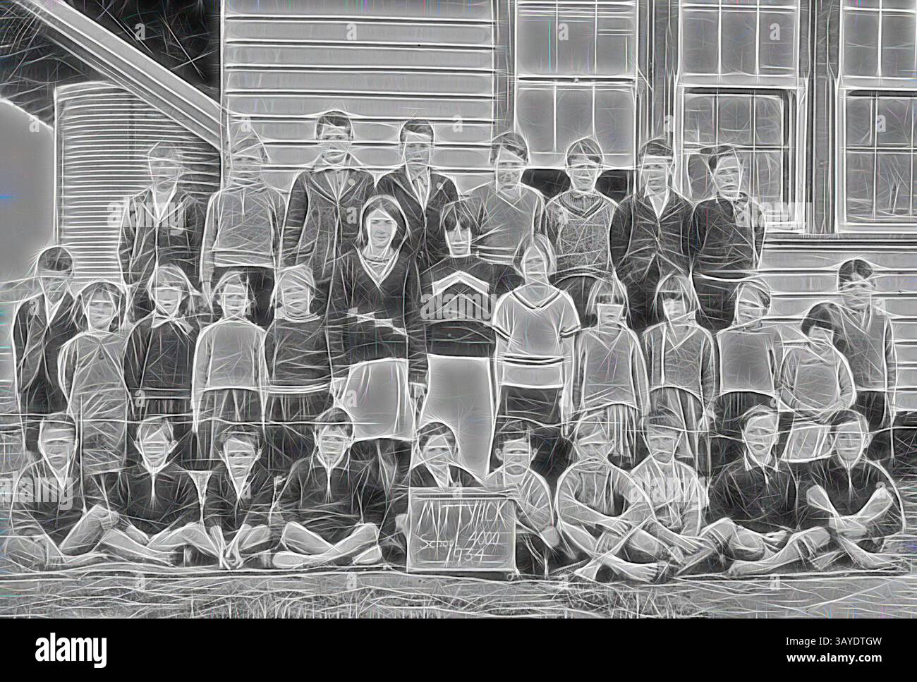 A group of children and adults, posed in neat rows in front of a ...