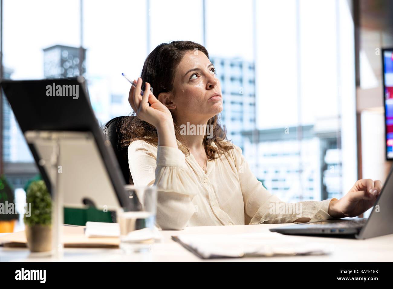 Female ceo thinking new ways hi-res stock photography and images - Alamy