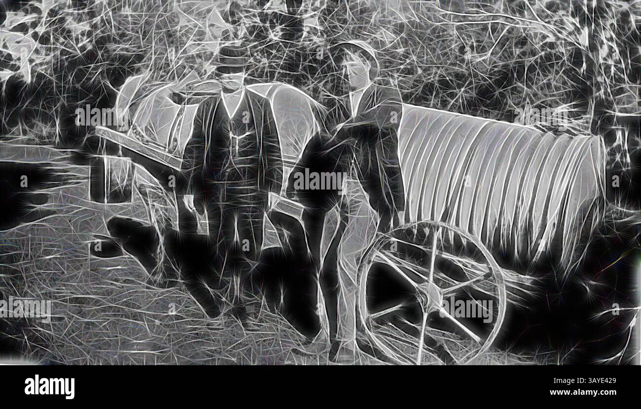 Two men stand together beside a large wheel and wagon, set against a ...