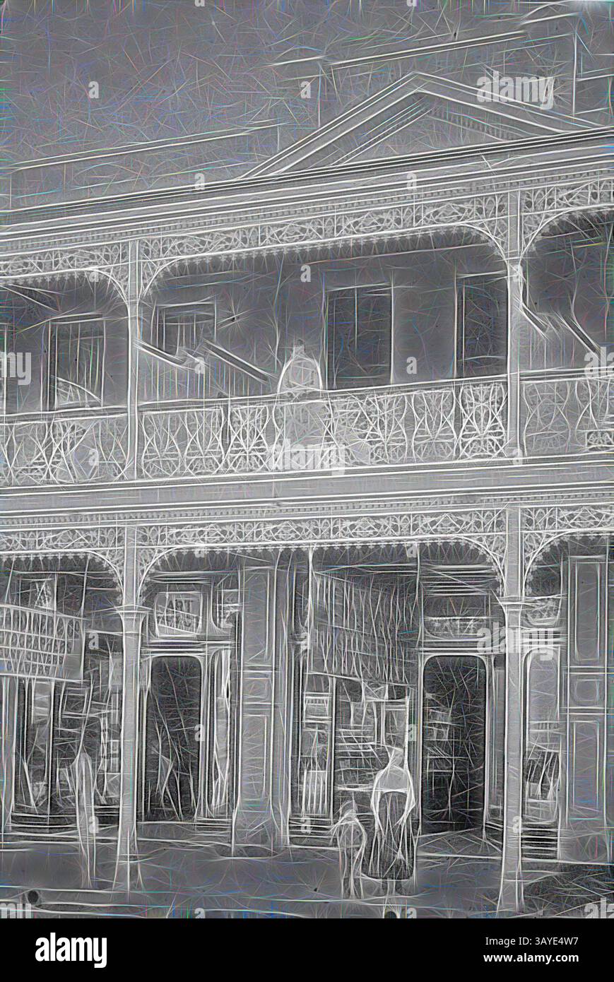 A historic building features ornate ironwork balconies and large ...