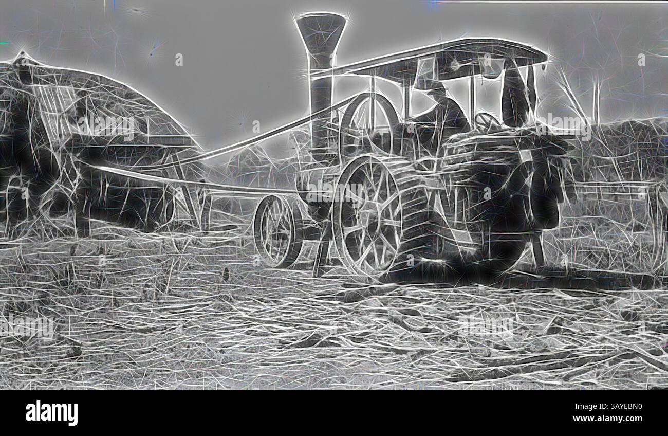 An old steam engine sits in a field, its intricate design and wheels ...