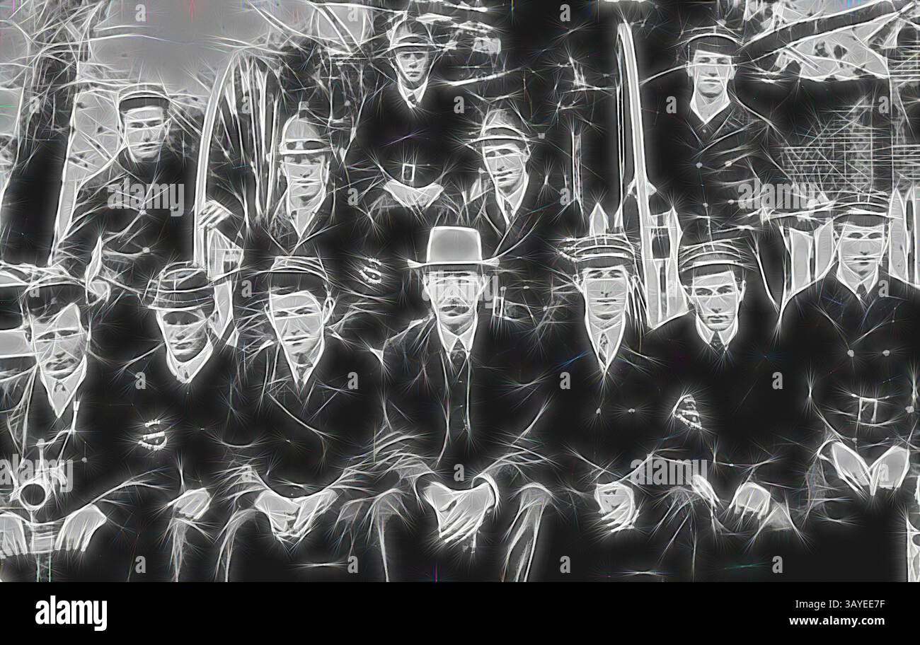 A group of men dressed in formal attire, seated and standing in a ...