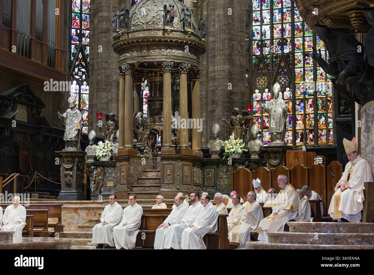 Archbishop of Milan Mario Del Pini and some altar servers on the altar ...