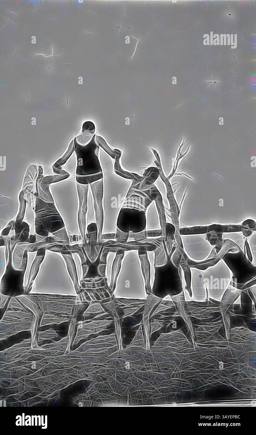 A group of athletes forms a human pyramid, balancing skillfully while ...