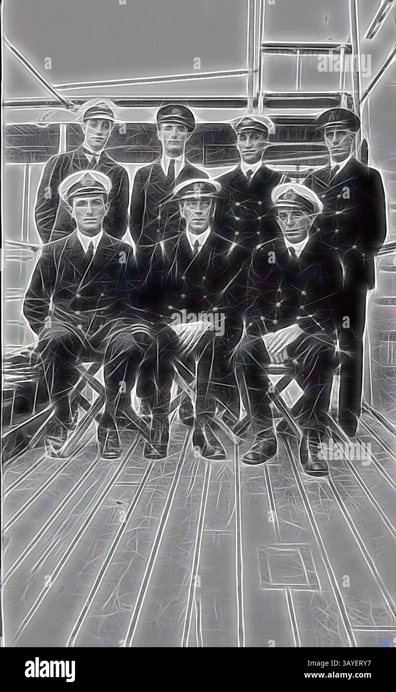 A group of seven men in formal attire and caps, seated and standing ...