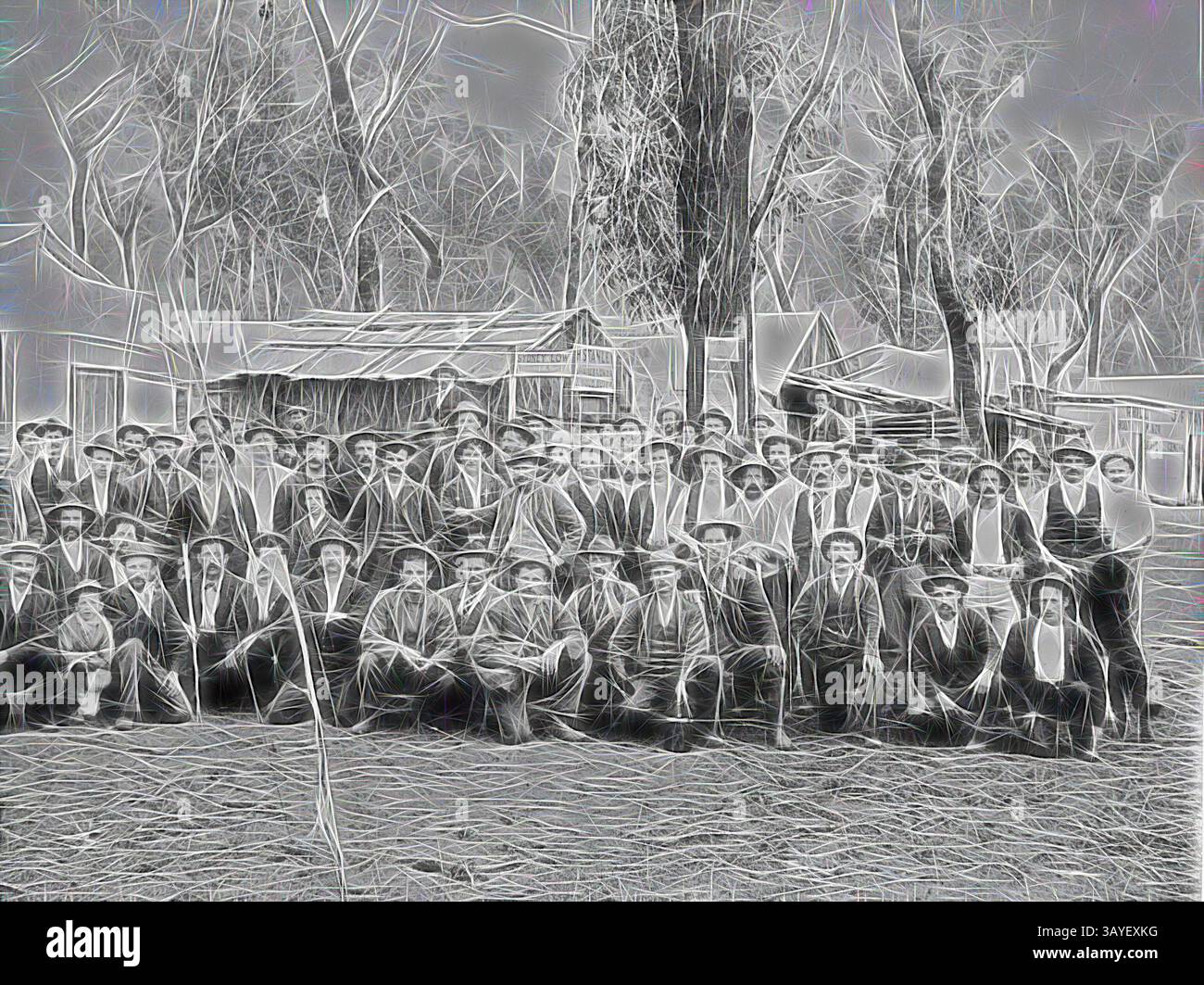 A large group of men, dressed in traditional attire, poses together ...