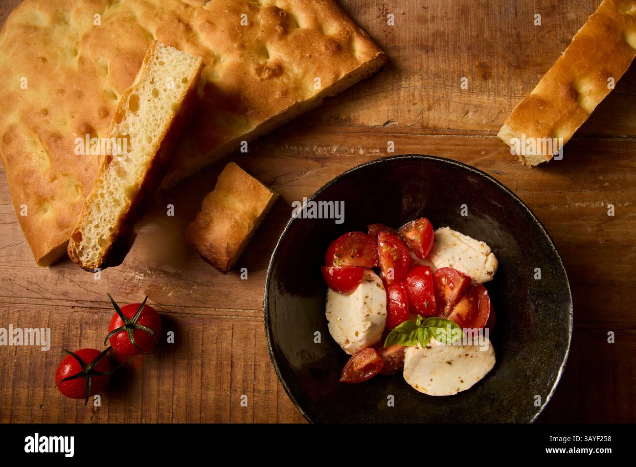 Rustic Italian Focaccia with Caprese Salad Stock Photo - Alamy