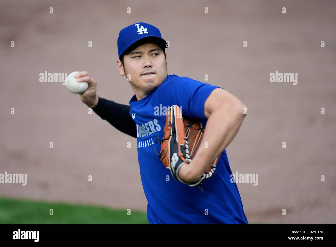 Los Angeles Dodgers' Shohei Ohtani (17) warms before a baseball game ...