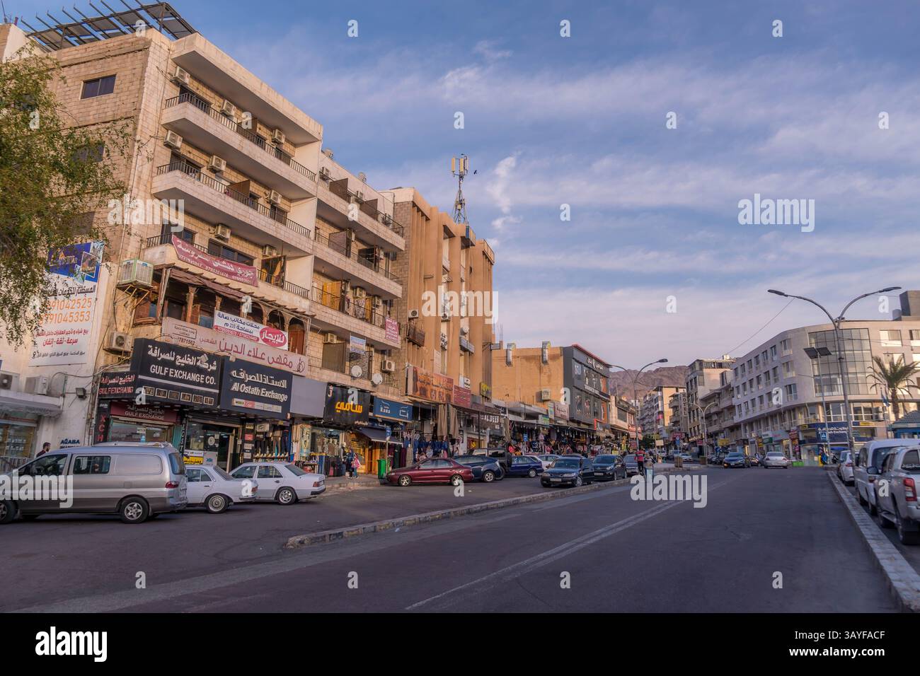Vibrant Middle Eastern street scene in Aqaba, Jordan: busy commerce ...