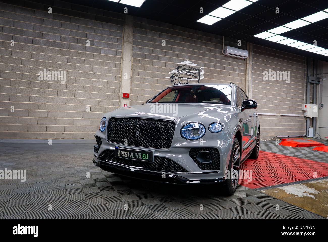 Bentley Bentayga in Light Gray with Roof Rack in Indoor Setting Stock ...