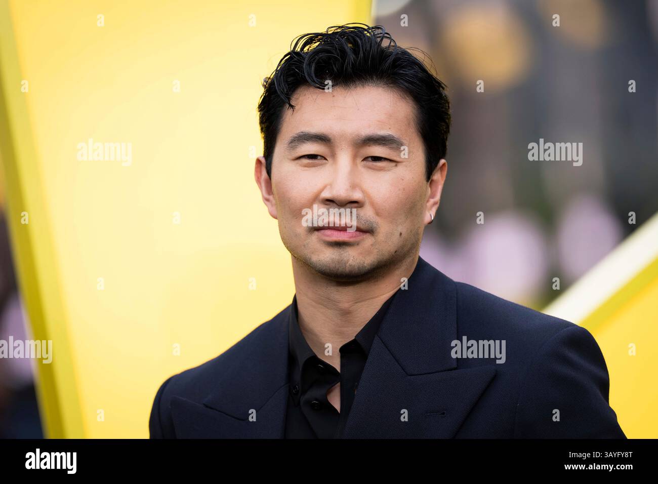 Simu Liu poses for photographers upon arrival at a screening of the ...