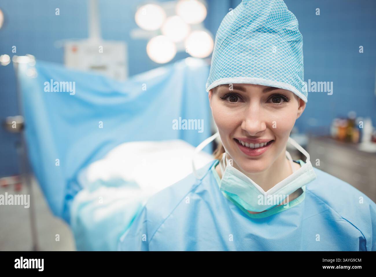 Female surgeon preparing surgical instruments in operating room ...