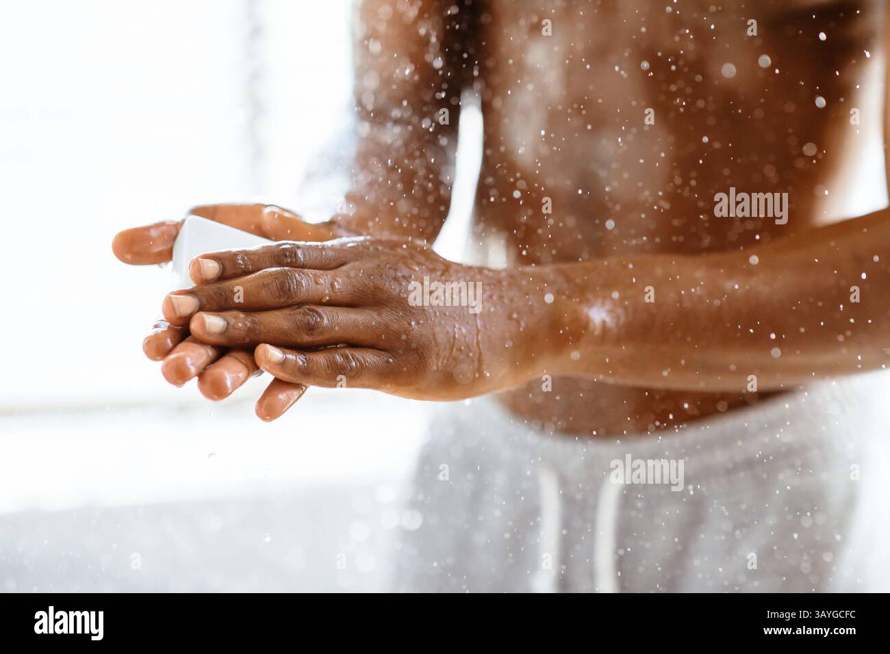 Black Man Washing Hands With Soap Taking Shower In Bathroom Stock Photo ...
