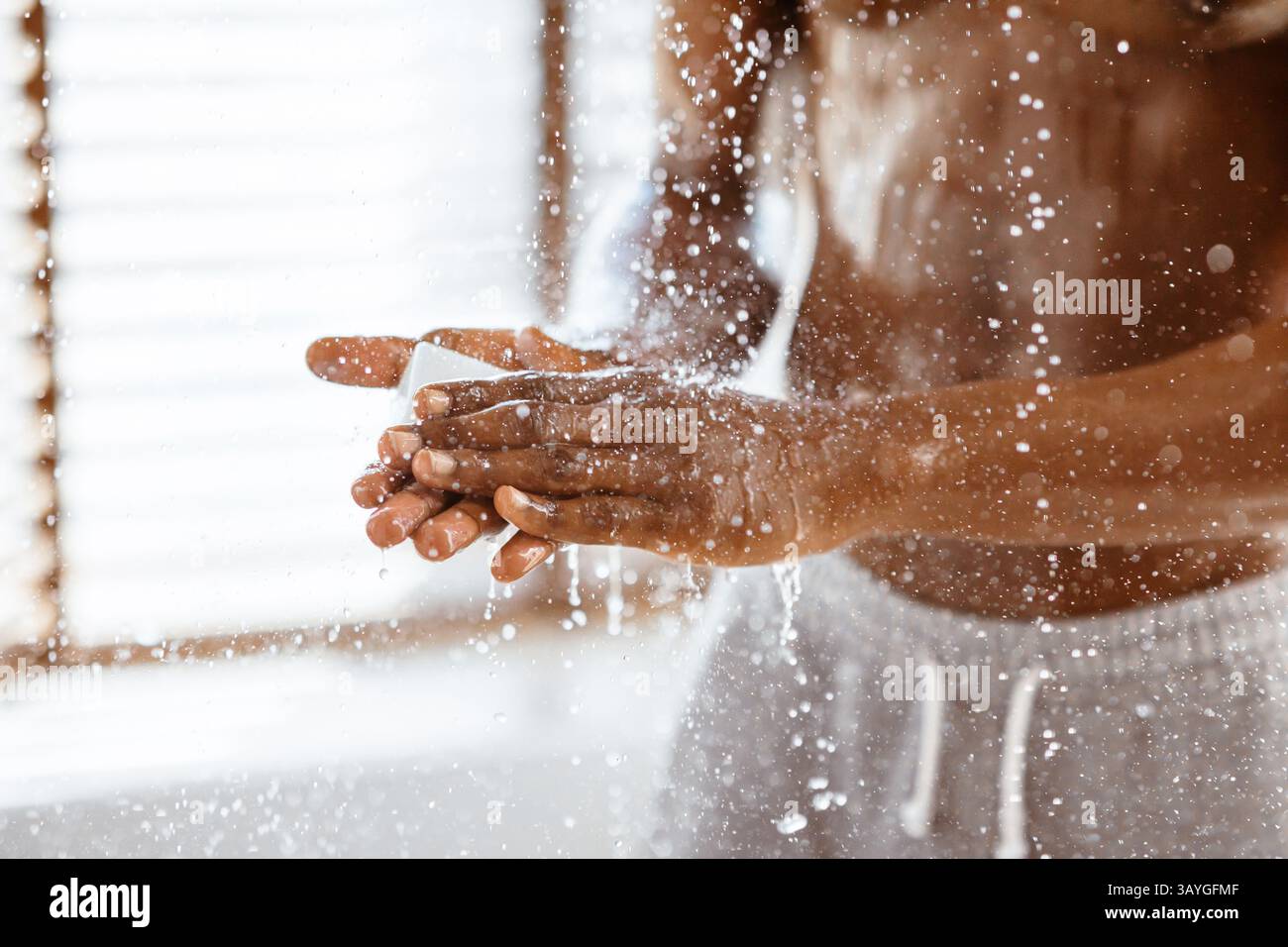 African Man Washing Hands With Soap Taking Shower In Bathroom Stock ...