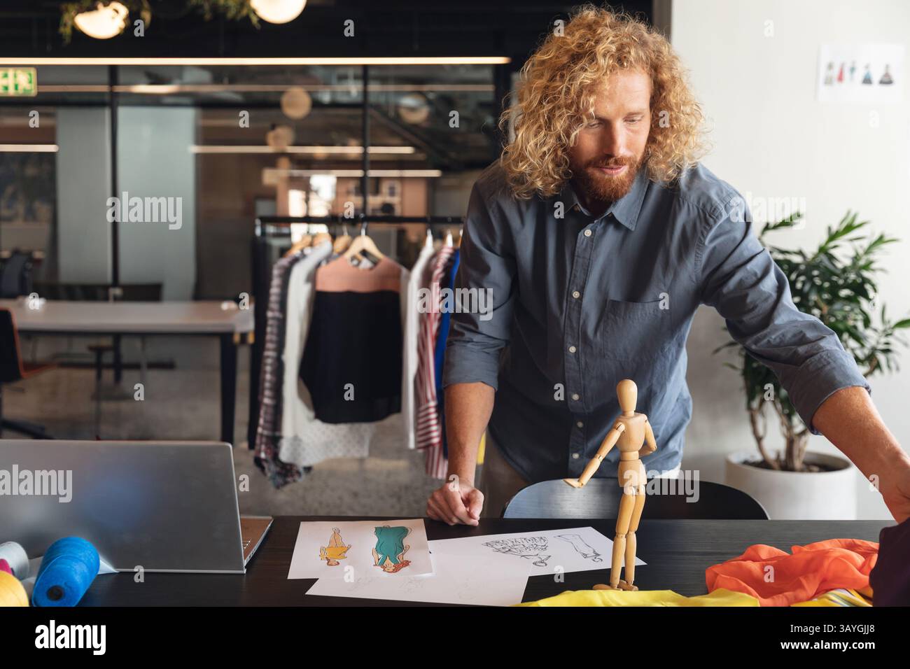 Male fashion designer reviewing hi-res stock photography and images - Alamy