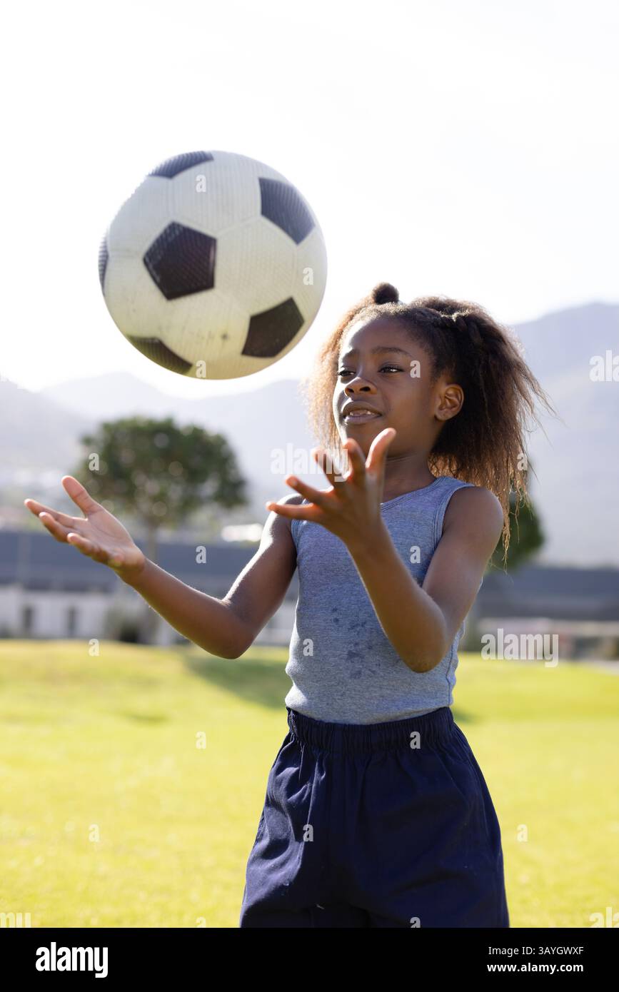 African girl catching ball hi-res stock photography and images - Alamy