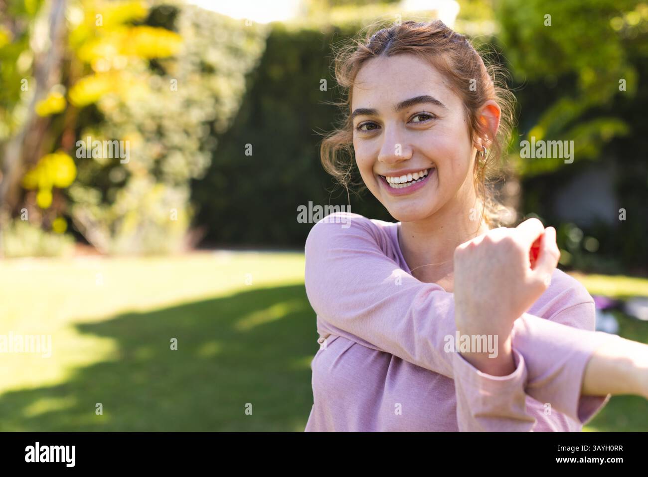 Woman stretching arm across hi-res stock photography and images - Alamy