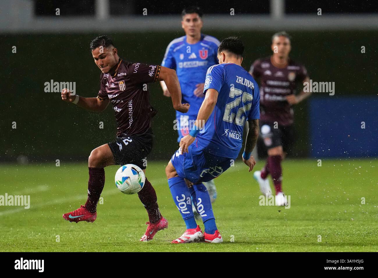 Marcel Guaramato of Venezuela's Carabobo FC, left, dribbles past Matias ...