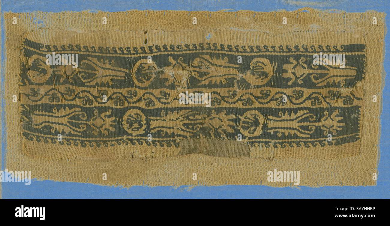 An intricate textile featuring a repeating pattern of stylized floral ...