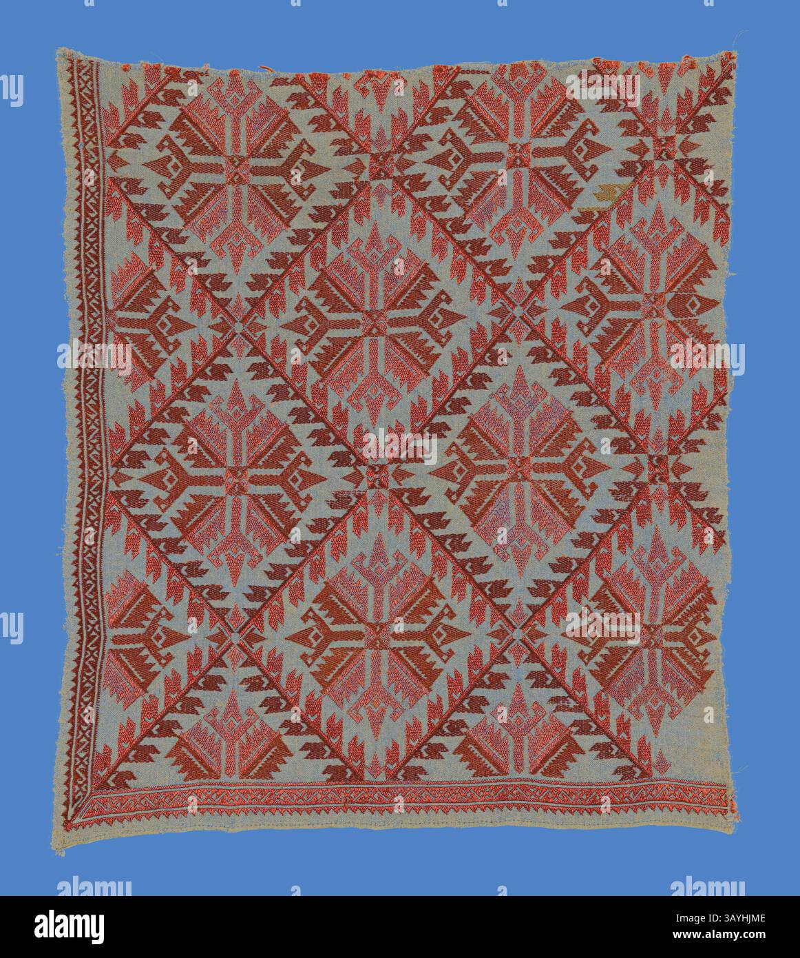 A beautifully woven textile featuring intricate geometric patterns in ...