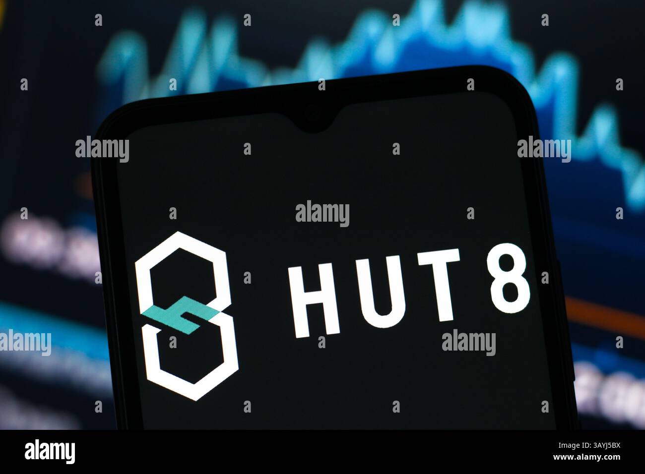 In this photo illustration, the Hut 8 logo is seen displayed on a ...