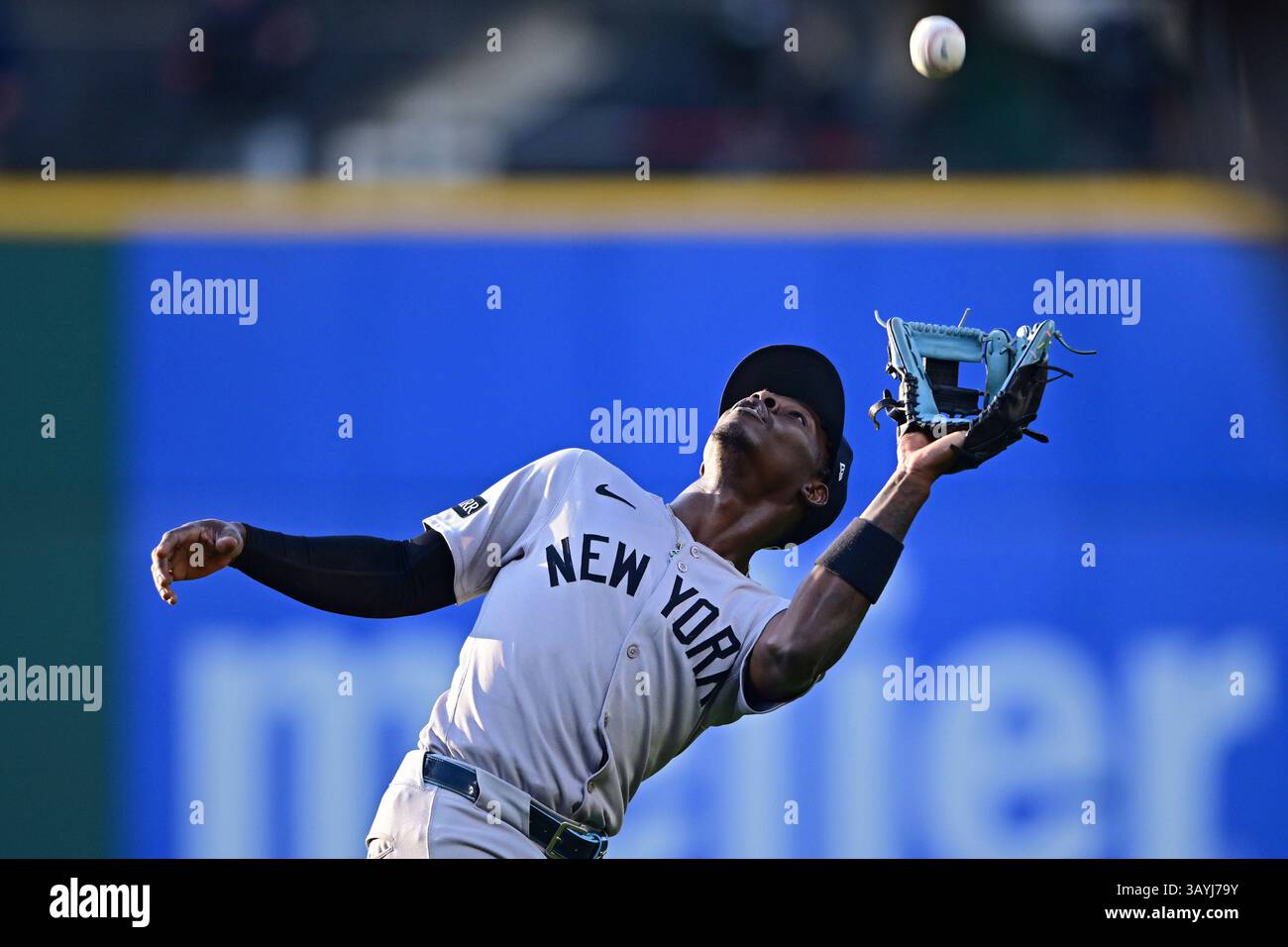 New York Yankees second baseman Jazz Chisholm Jr. catches a ball hit by Cleveland Guardians ...