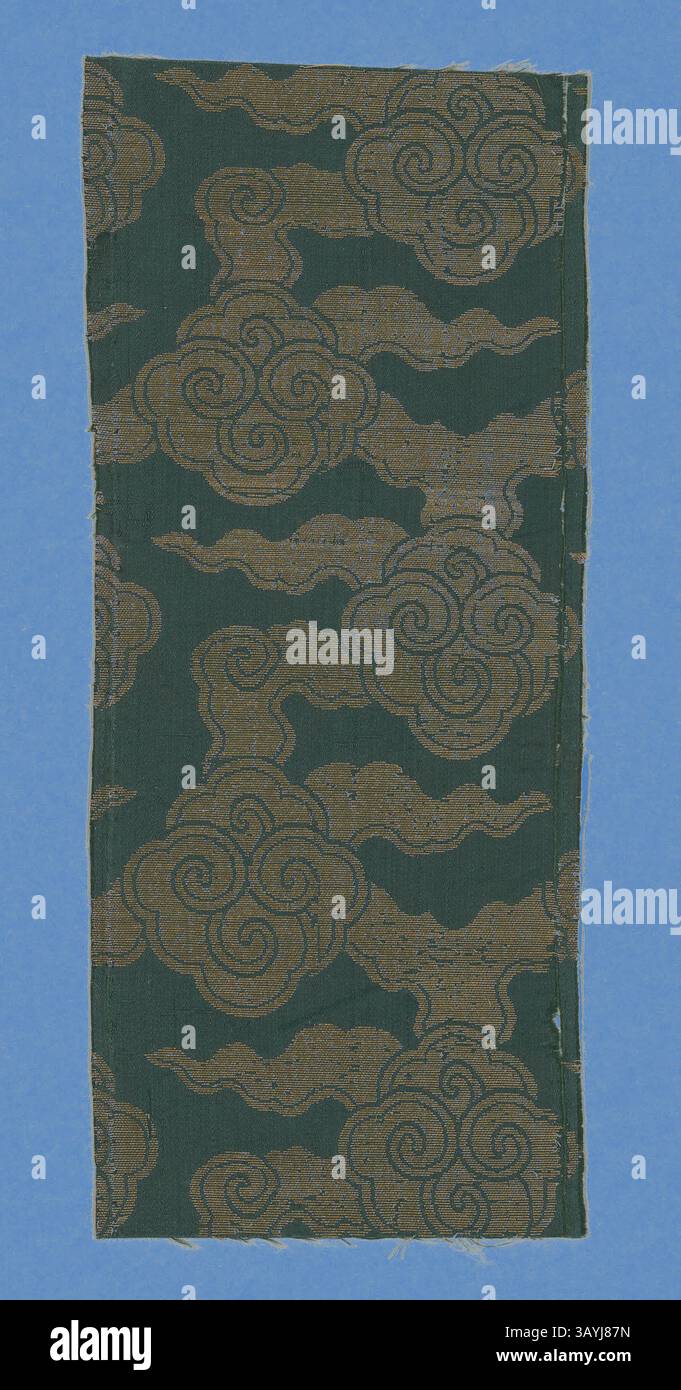 A textile featuring intricate swirling cloud patterns in shades of gold ...