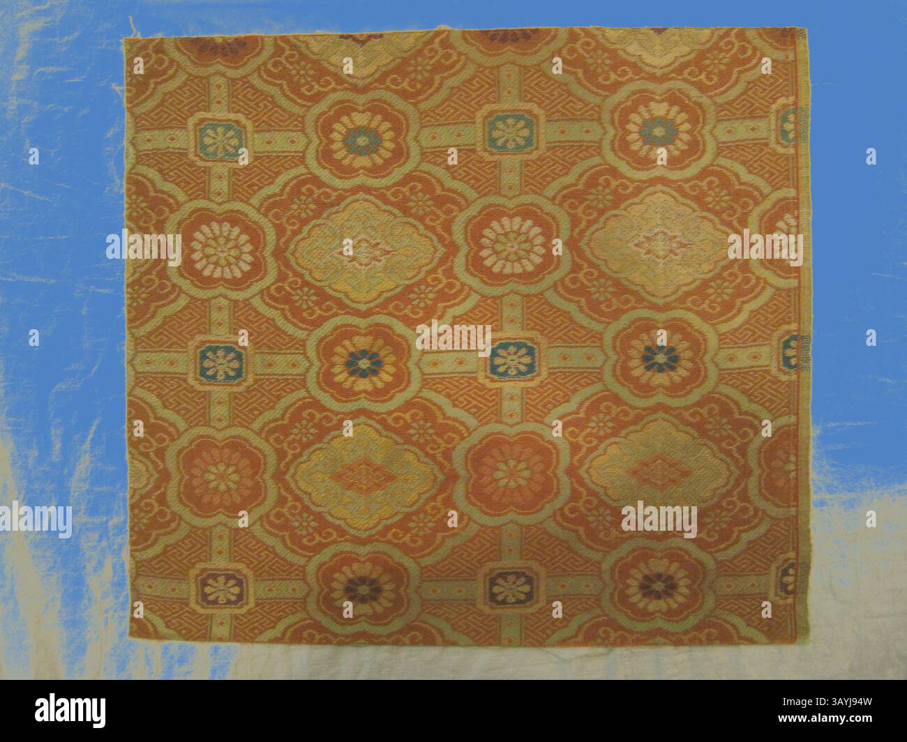 A vibrant textile featuring a repeating geometric pattern with floral ...