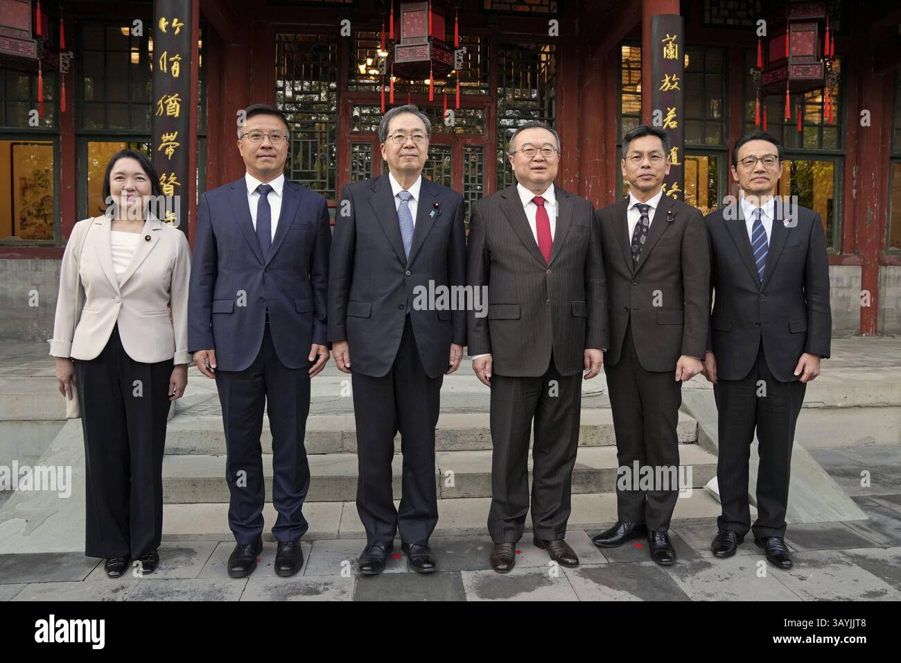 Tetsuo Saito (3rd from L), chief of Japan's junior ruling coalition ...
