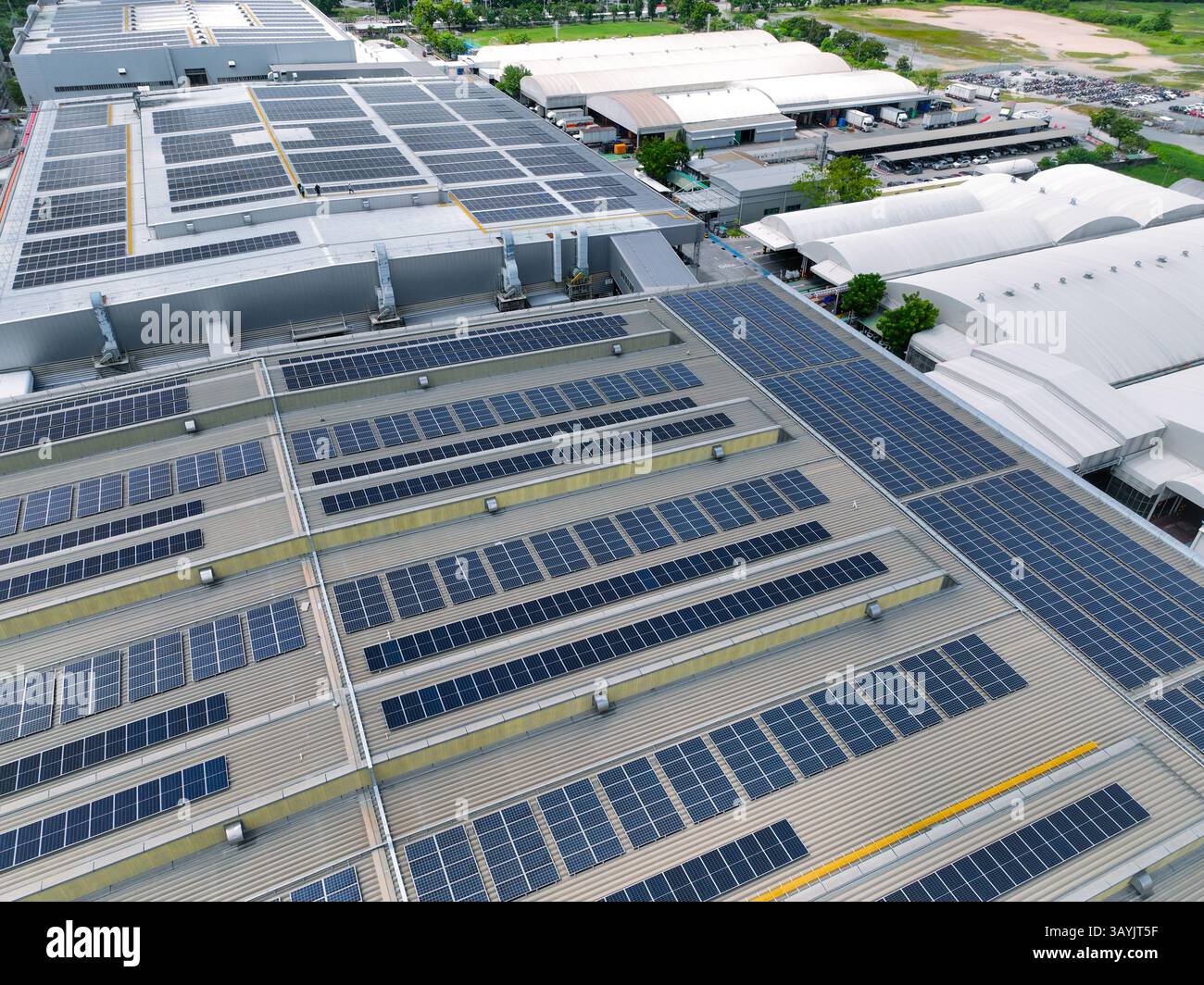 Solar-powered warehouse facility. Modern distribution center with ...