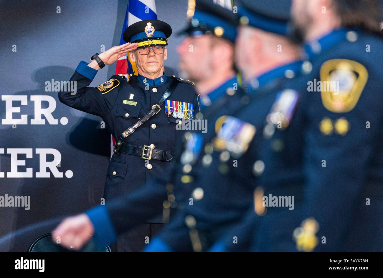 Chief Norm Lipinski of the Surrey Police Service salute members of his ...