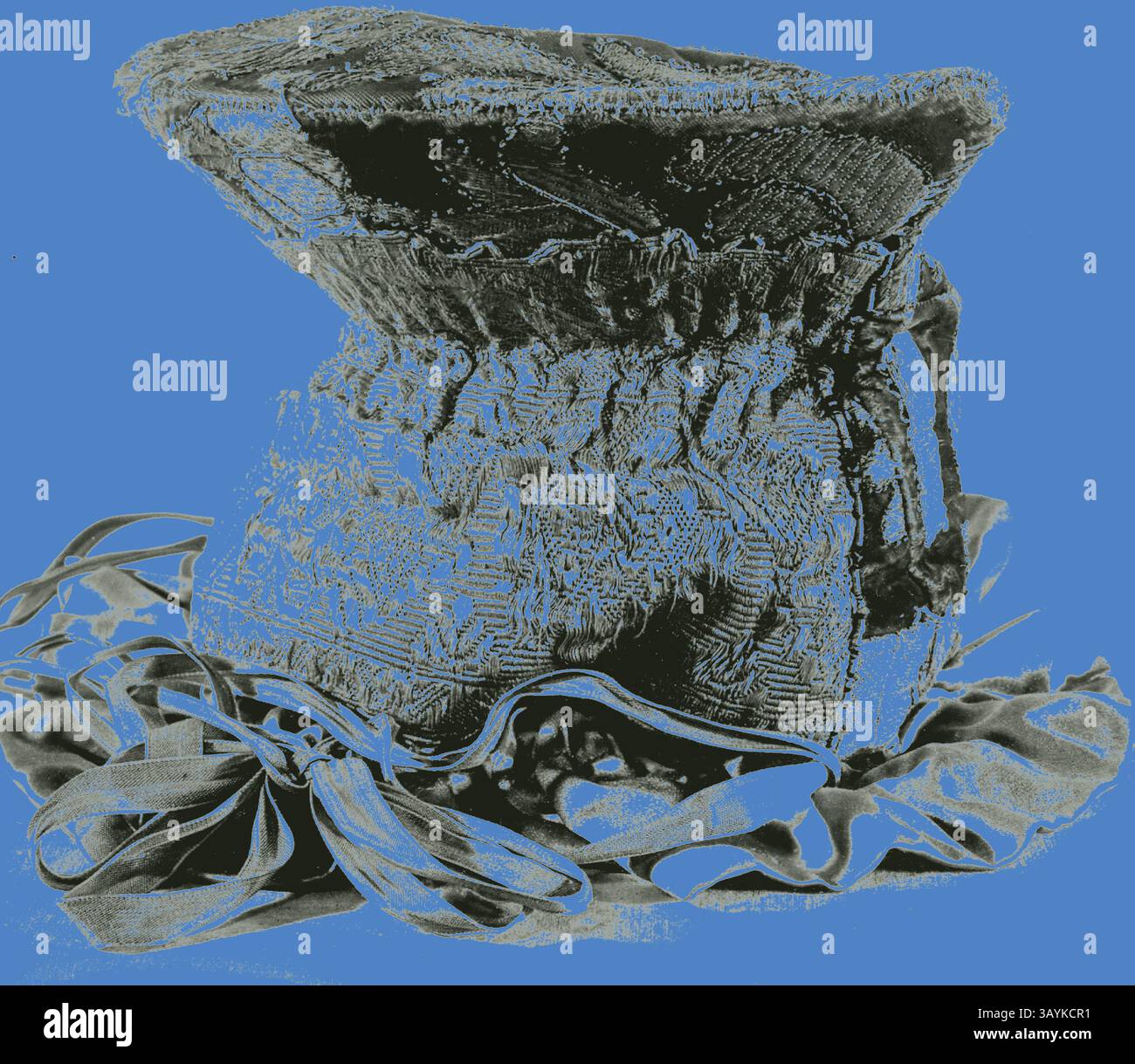 An intricately designed bonnet featuring delicate lace and ribbon ...