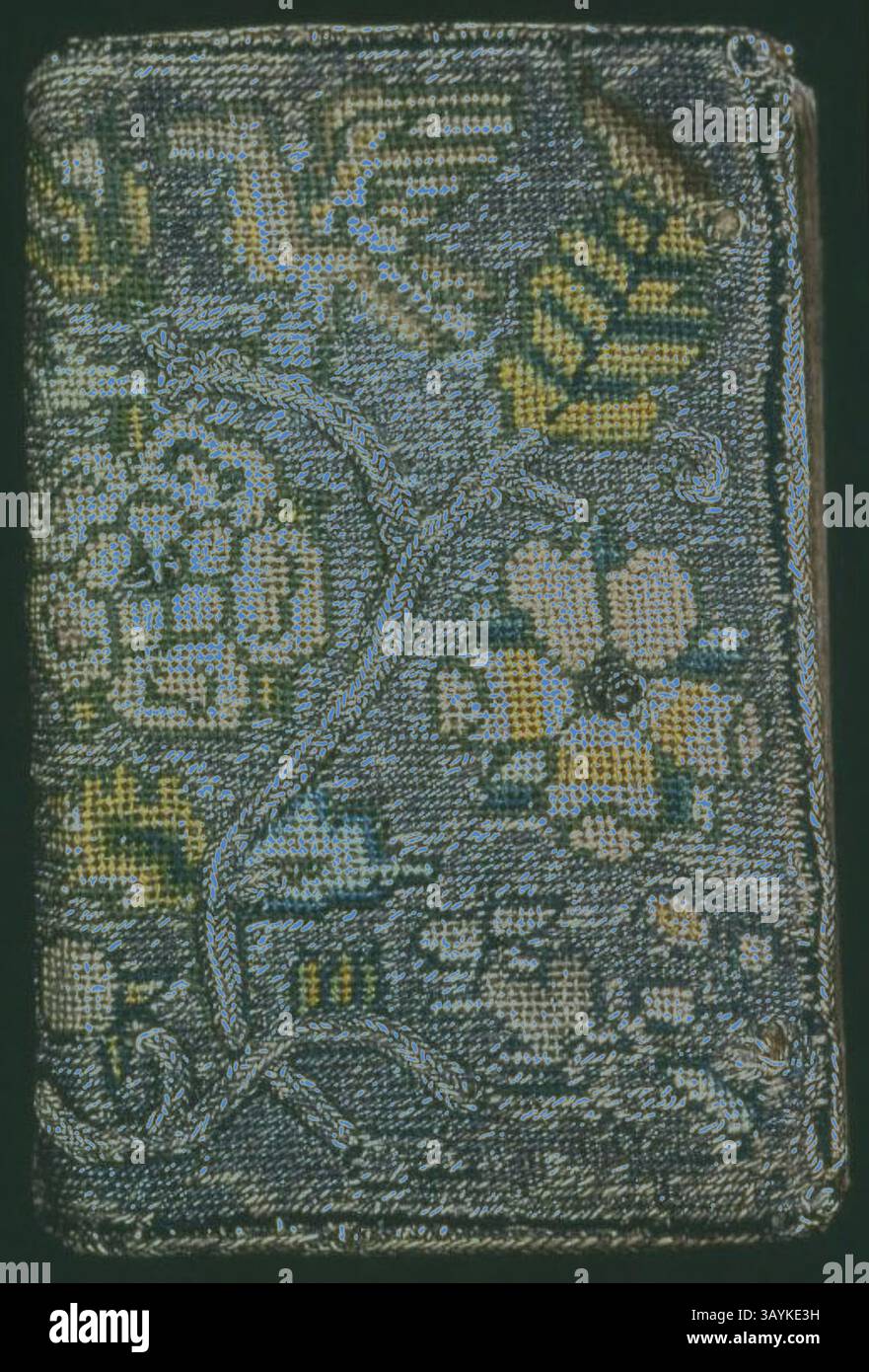 An intricately designed textile piece featuring floral and vine motifs ...